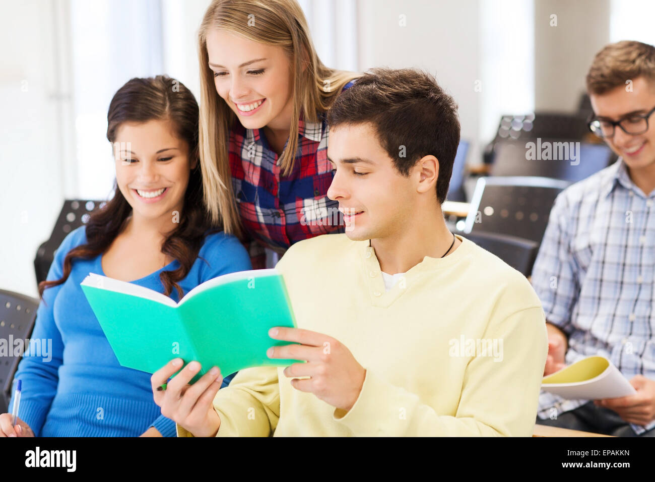 group of smiling students with notebooks Stock Photo - Alamy