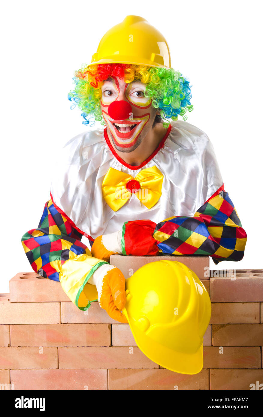 Bad construction concept with clown laying bricks Stock Photo - Alamy
