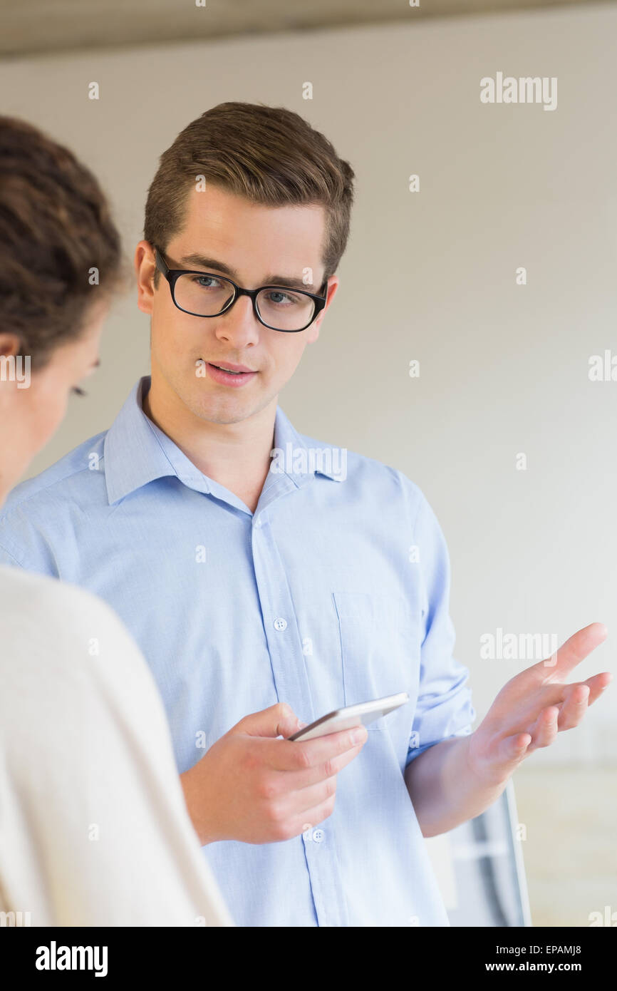 Business people communicating over mobile phone Stock Photo - Alamy