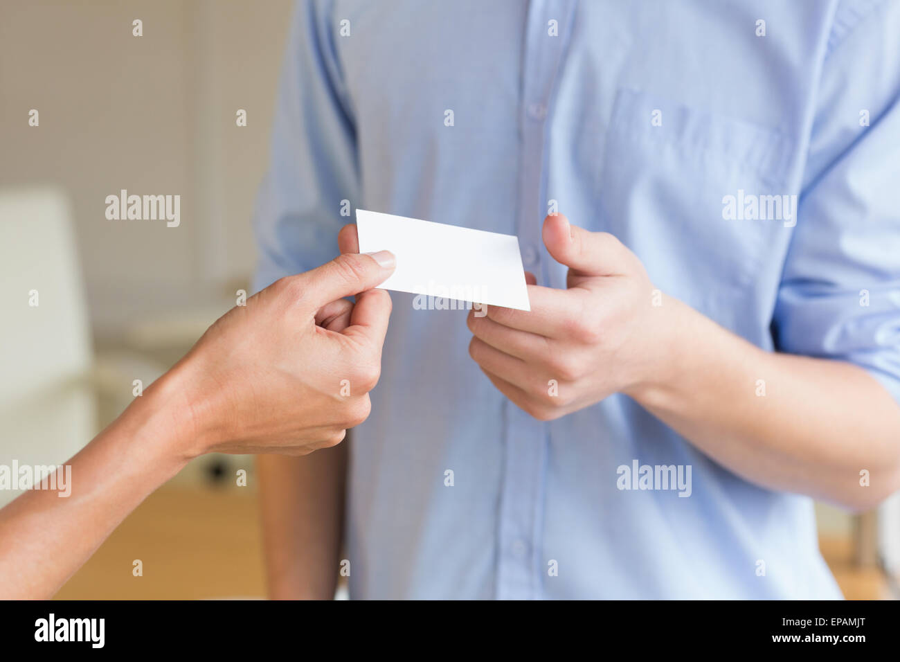 Business people exchanging visiting cards Stock Photo - Alamy