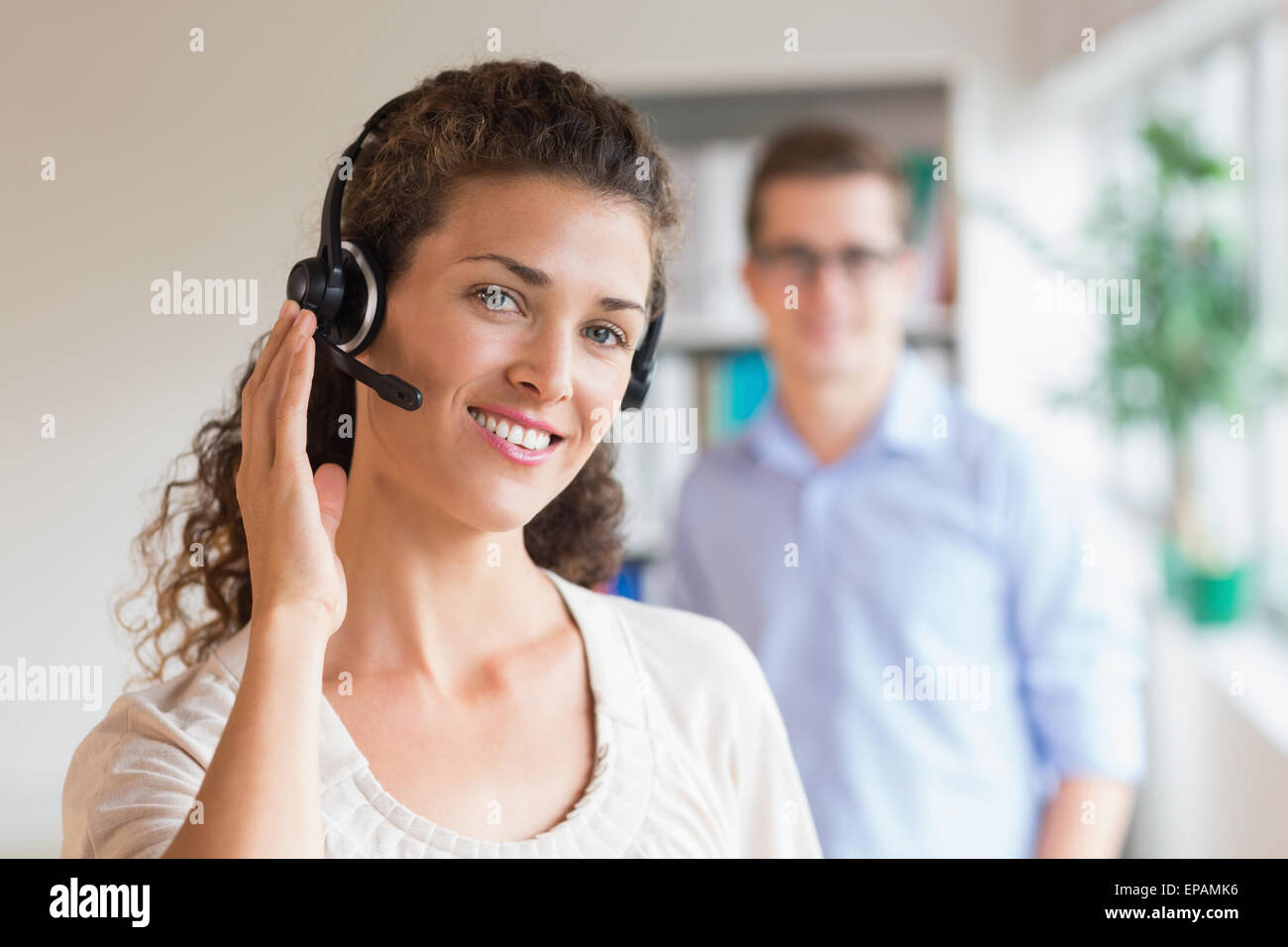 Female customer service representative wearing headset Stock Photo - Alamy