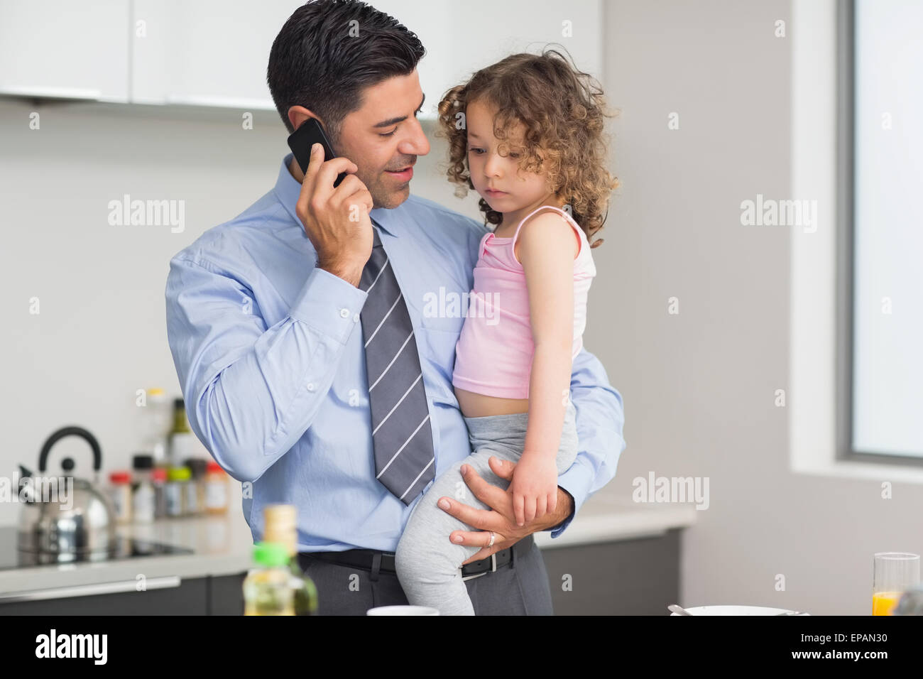 Father calling mobile phone family hi-res stock photography and images ...
