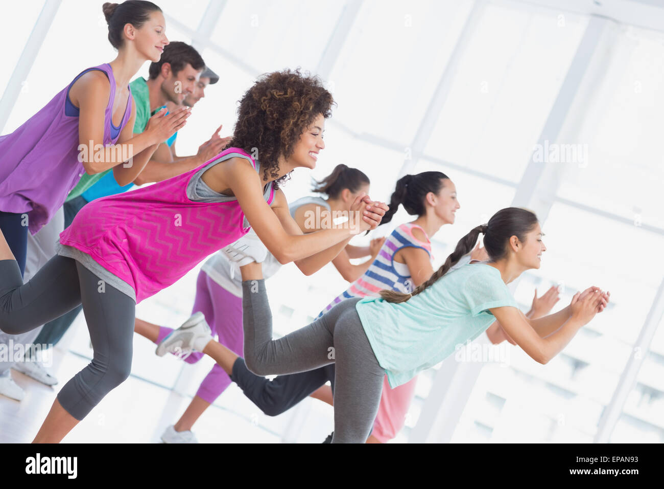 Fitness class and instructor doing pilates exercise Stock Photo - Alamy