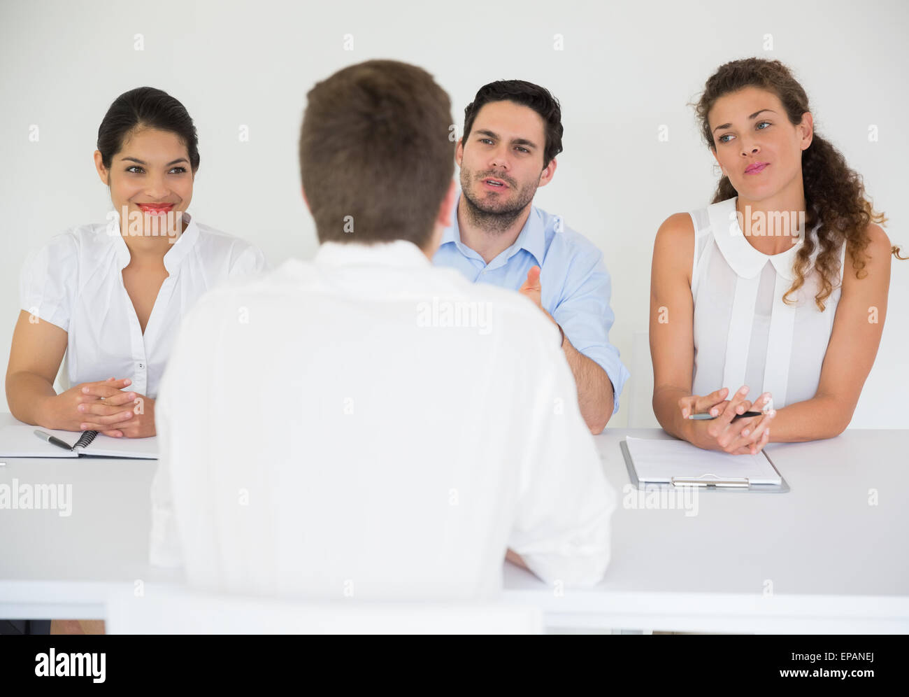 Man being interviewed by business people Stock Photo - Alamy
