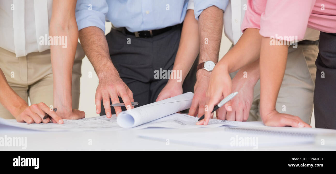Business people working on blueprint Stock Photo - Alamy
