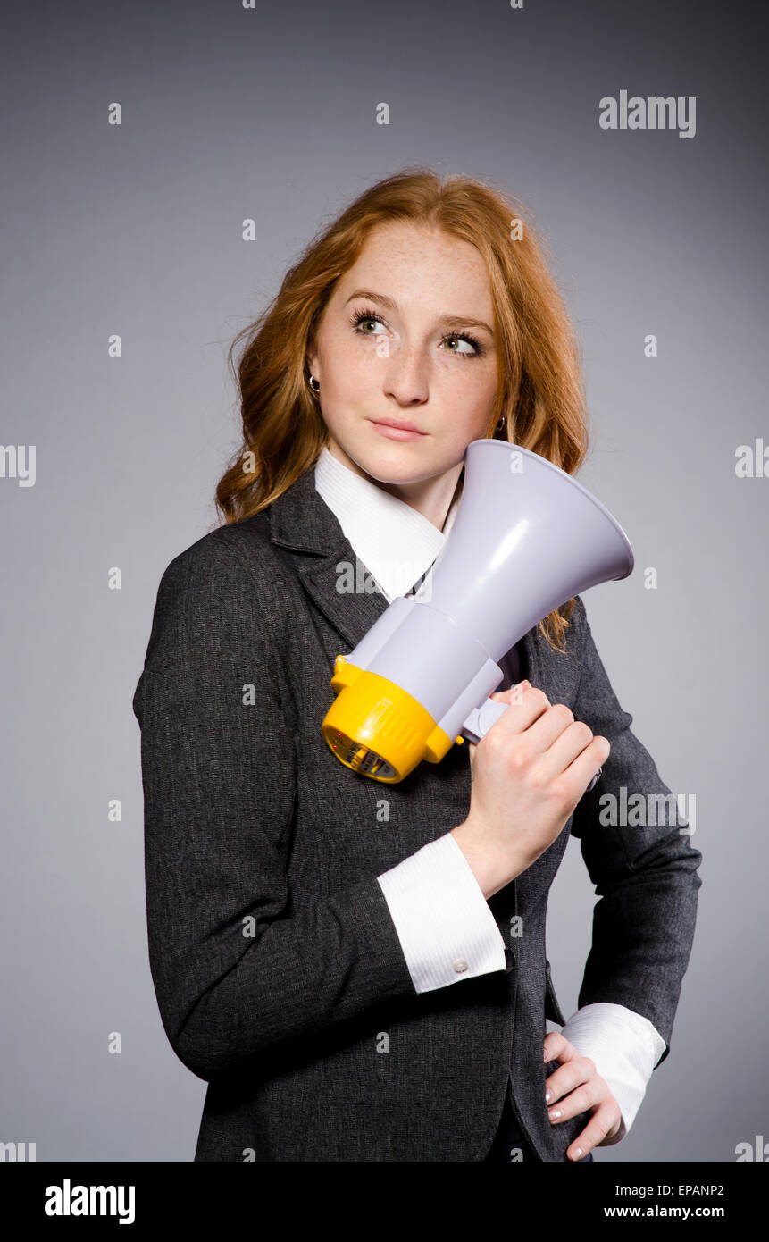 Woman with loudspeaker in studio Stock Photo - Alamy