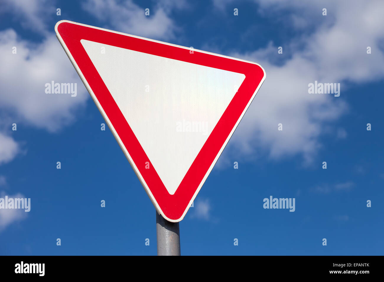 Traffic sign against blue sky background Stock Photo - Alamy
