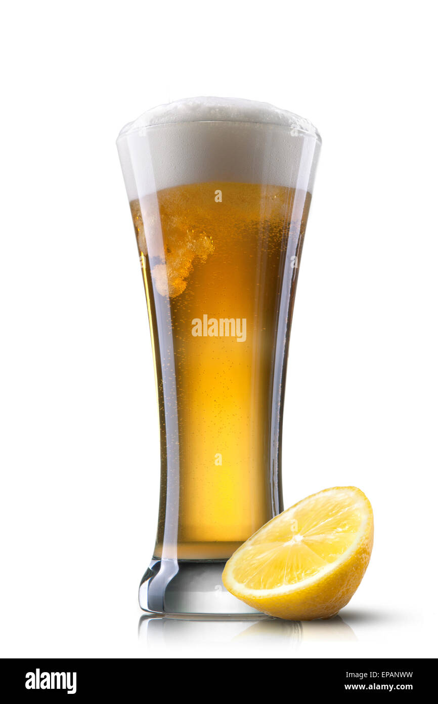 Beer in glass with lemon isolated on white background Stock Photo - Alamy