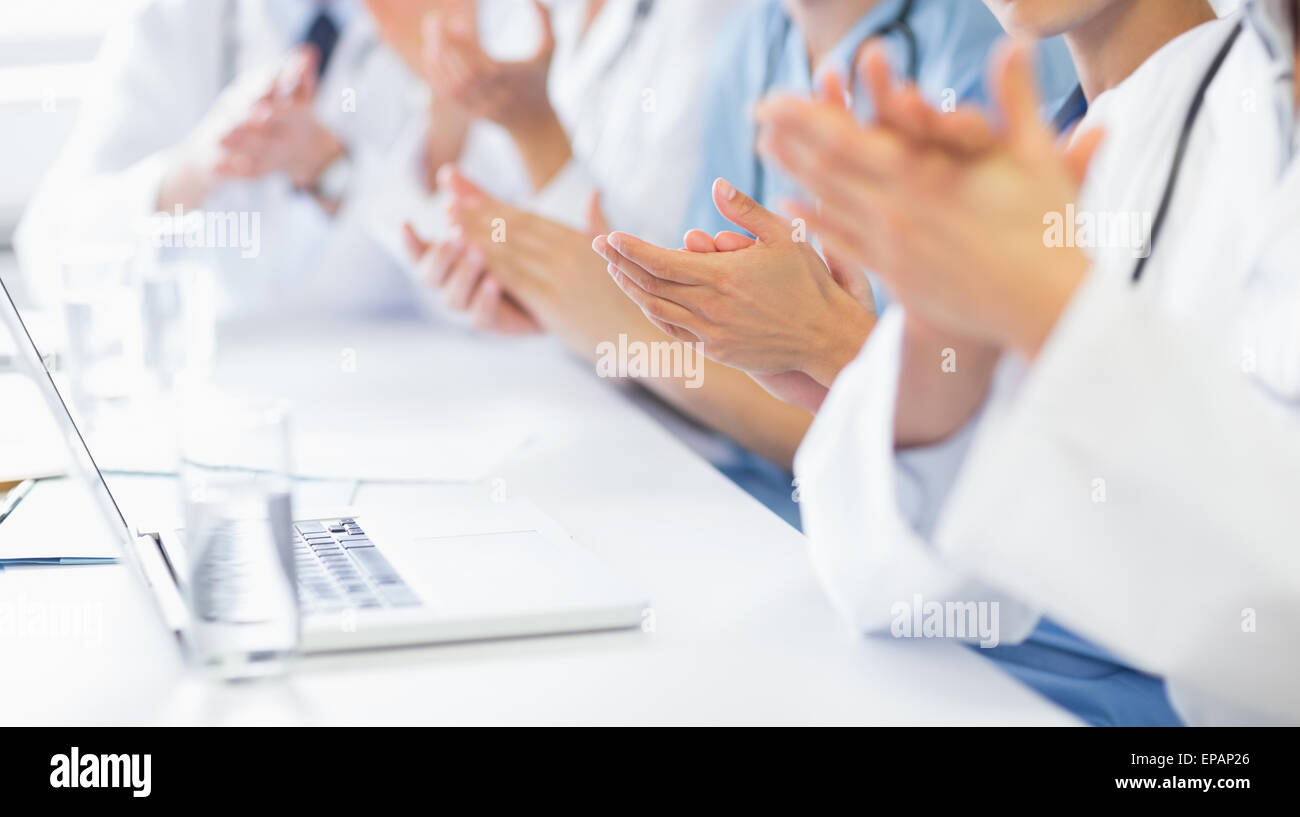 Medical team clapping Stock Photo - Alamy