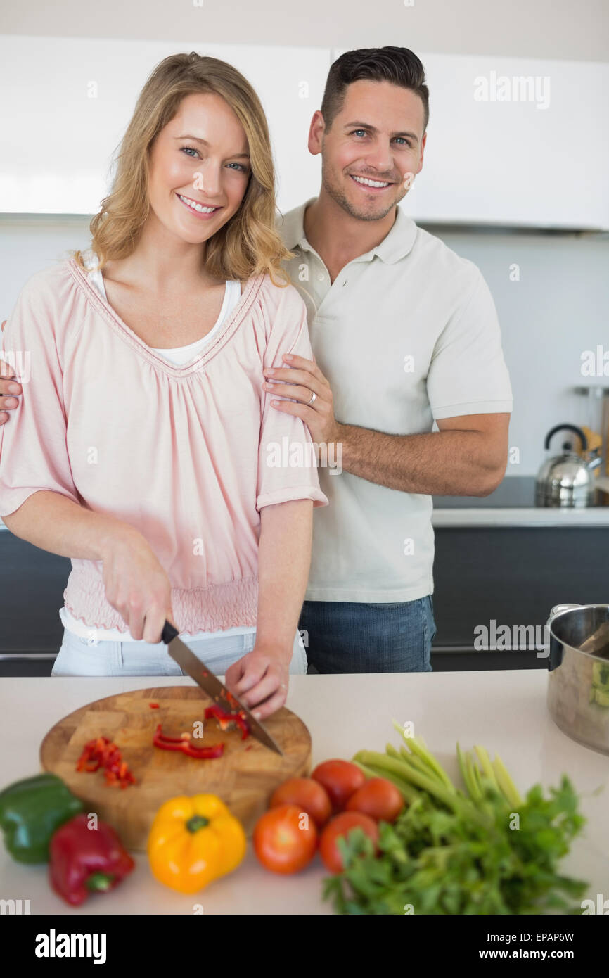 Couple preparing food together at kitchen counter Stock Photo - Alamy