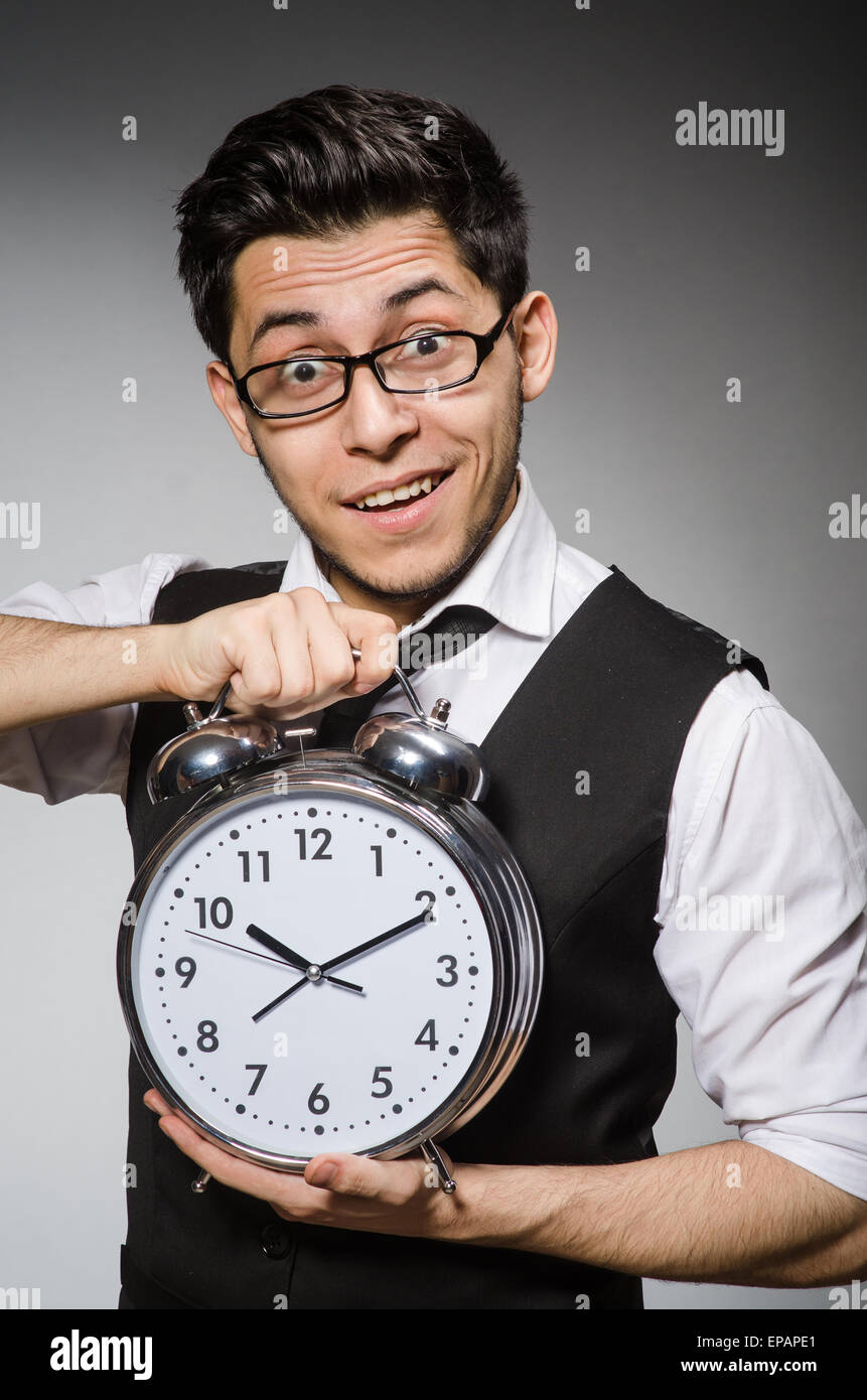 Businessman with clock in time concept Stock Photo - Alamy