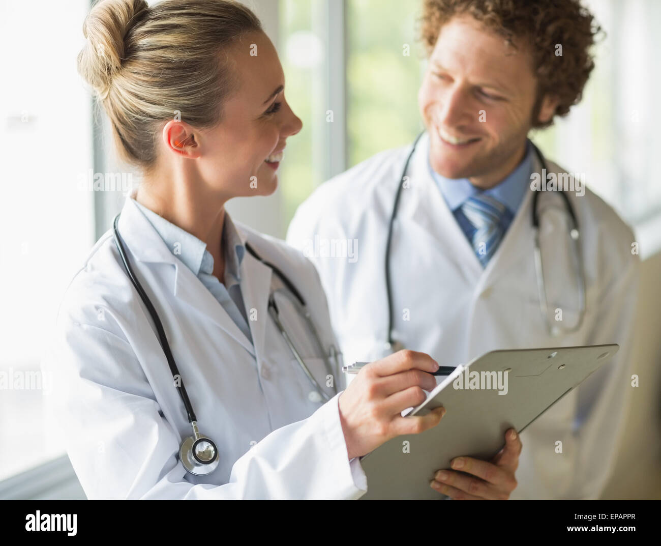 Doctors discussing in hospital Stock Photo - Alamy
