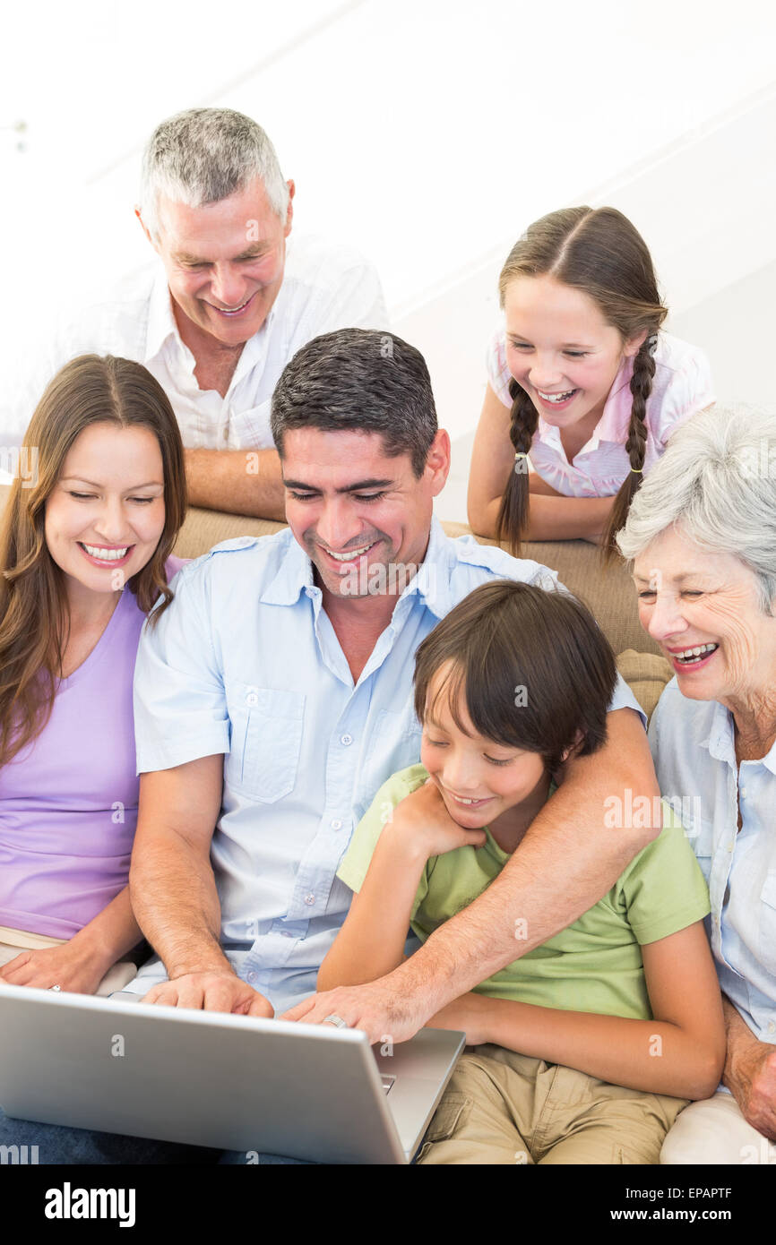 Multigeneration family using laptop Stock Photo - Alamy