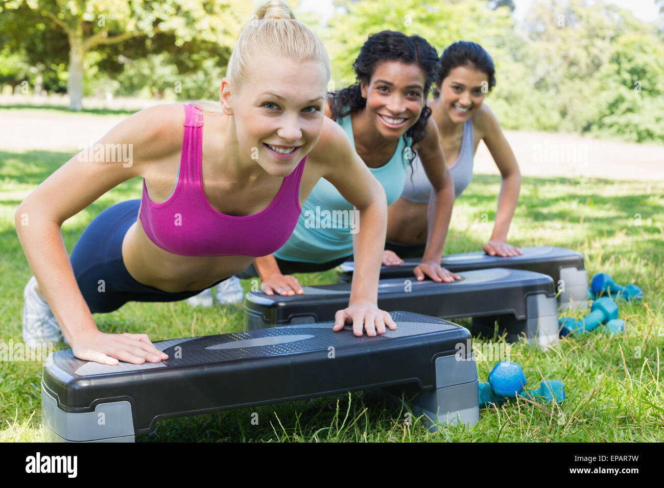 Sporty women doing step aerobics Stock Photo - Alamy