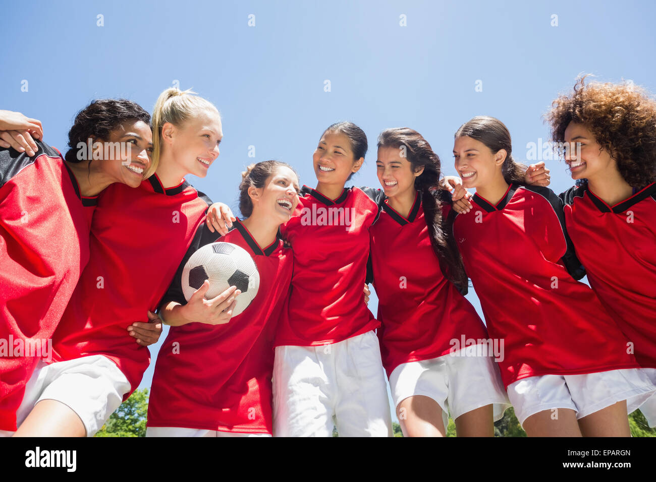 Female soccer team against clear sky Stock Photo - Alamy
