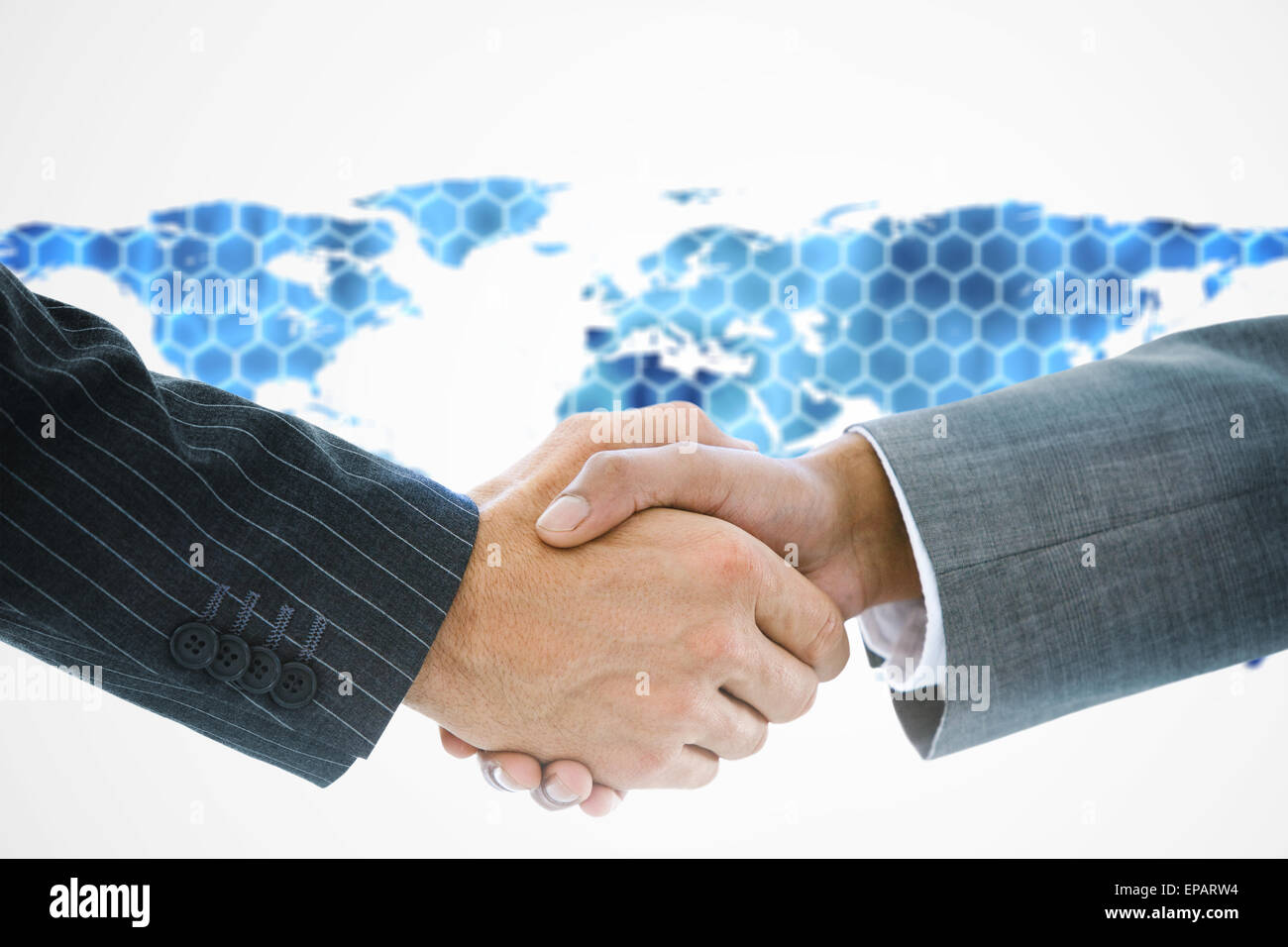 Composite image of business handshake Stock Photo - Alamy