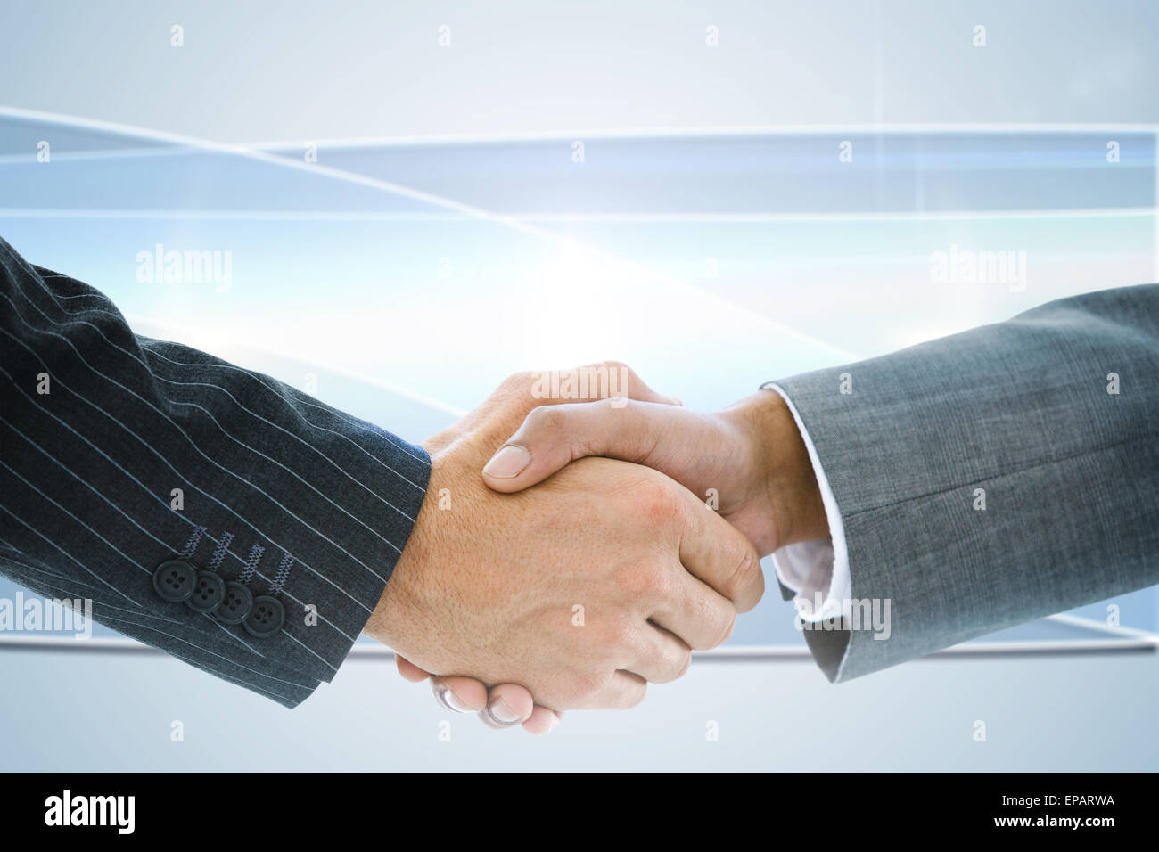 Composite image of business handshake Stock Photo - Alamy