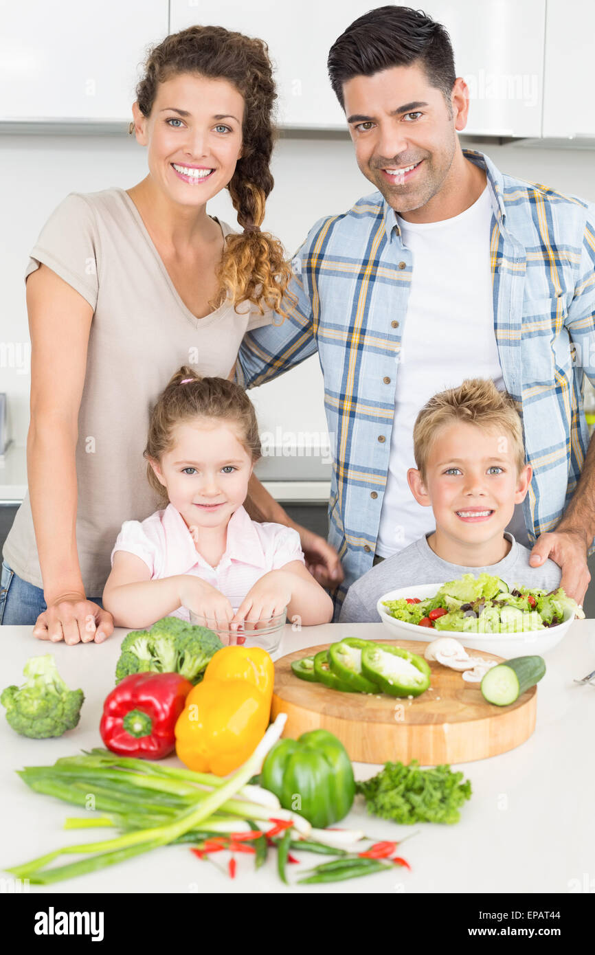 Happy family preparing vegetables together Stock Photo - Alamy