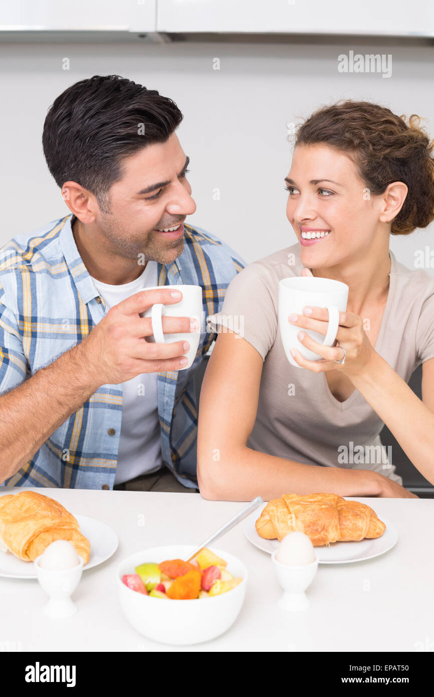 Attractive couple sitting having breakfast together Stock Photo - Alamy