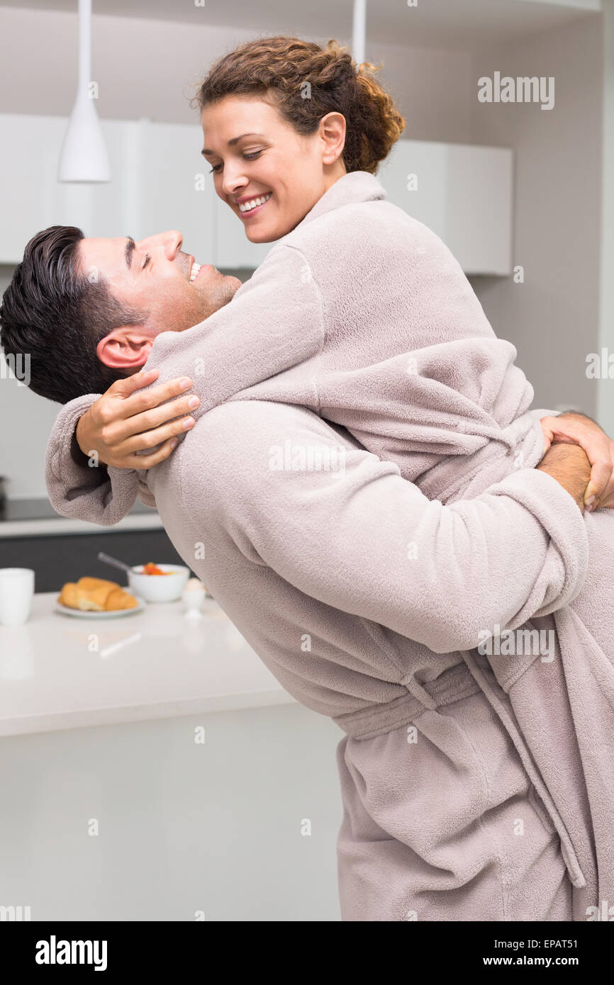 Man lifting and hugging his partner in the morning Stock Photo - Alamy