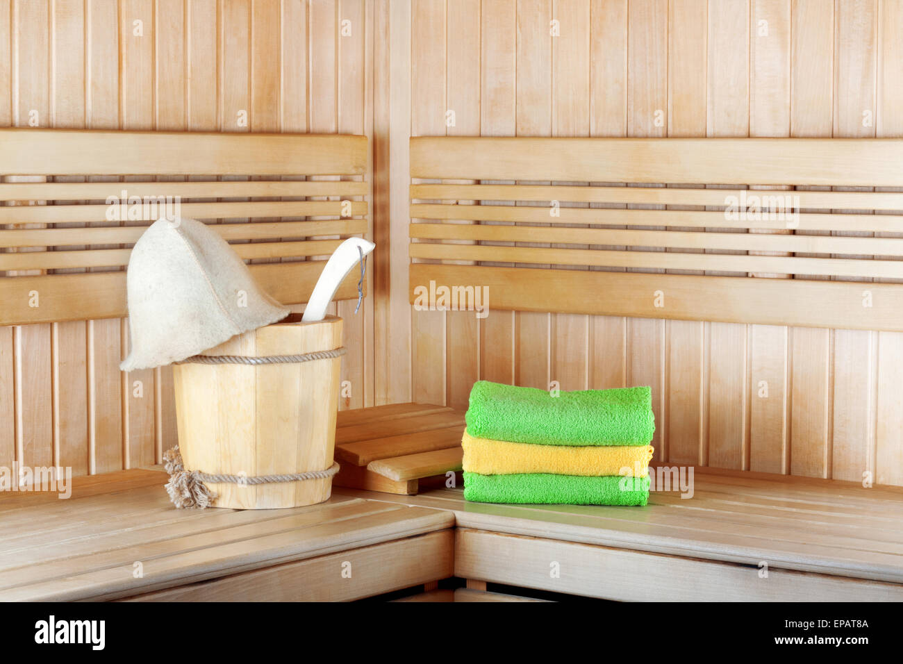 Traditional wooden sauna for relaxation with bucket of water and set of ...