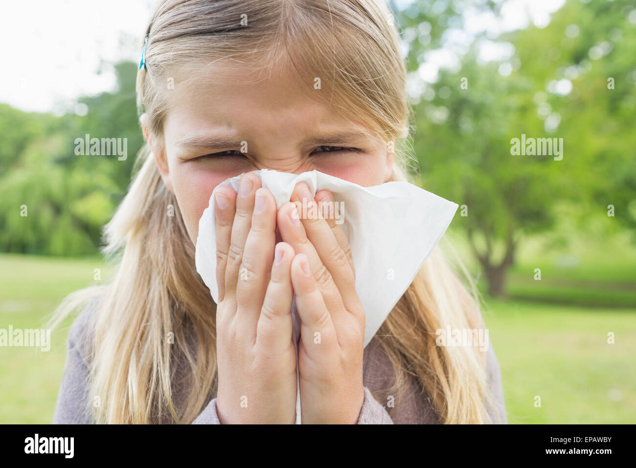 Girl blowing nose outdoors hi-res stock photography and images - Alamy