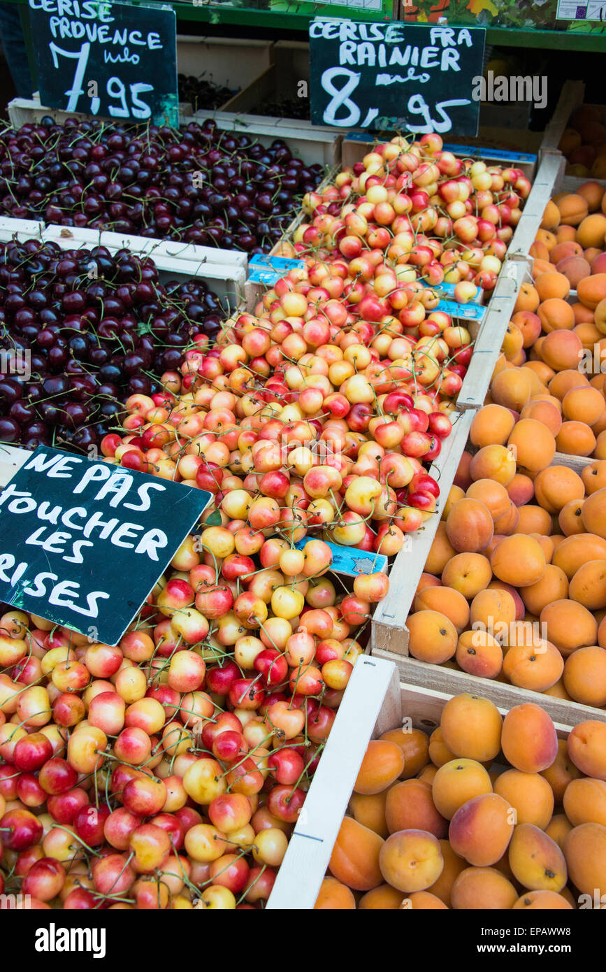 Cherries and appricots in market Stock Photo - Alamy