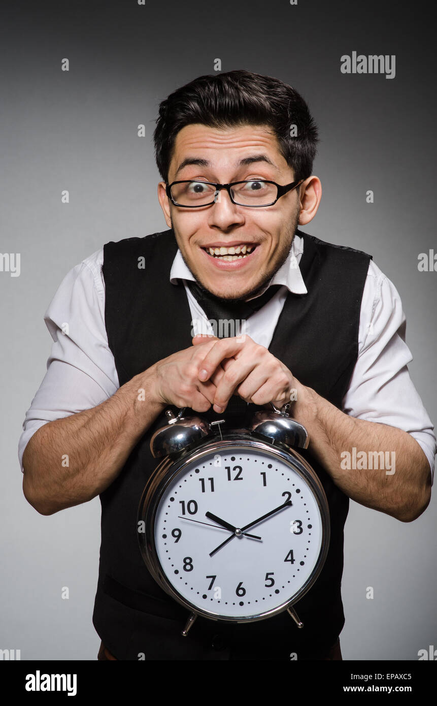Businessman with clock in time concept Stock Photo - Alamy
