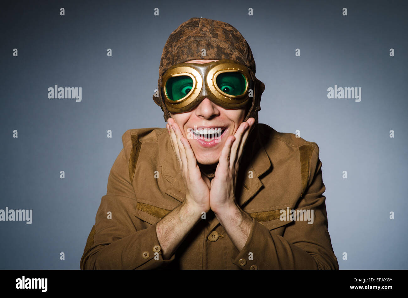 Funny pilot with goggles and helmet Stock Photo - Alamy
