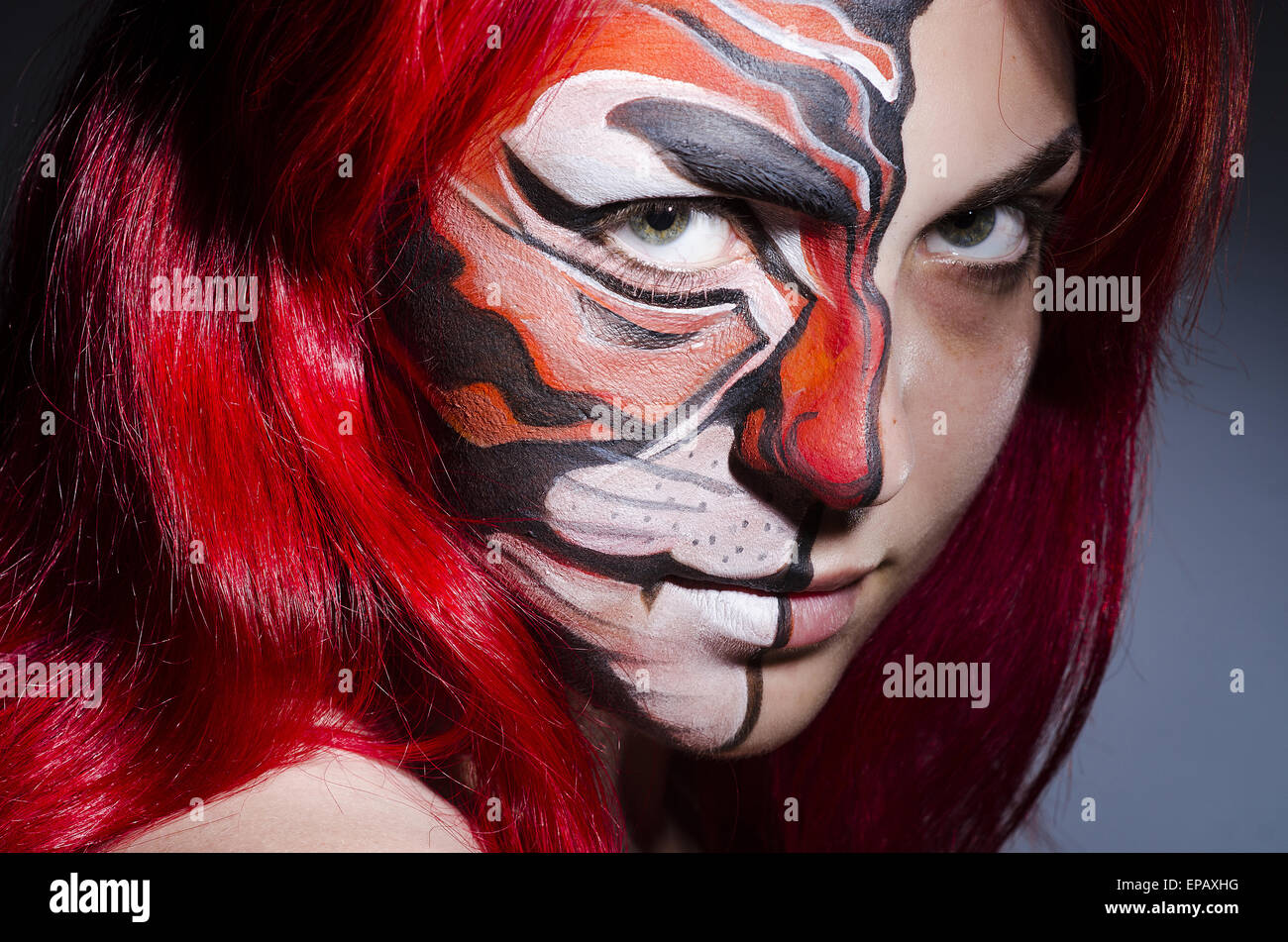 Woman with face painting in dark room Stock Photo - Alamy