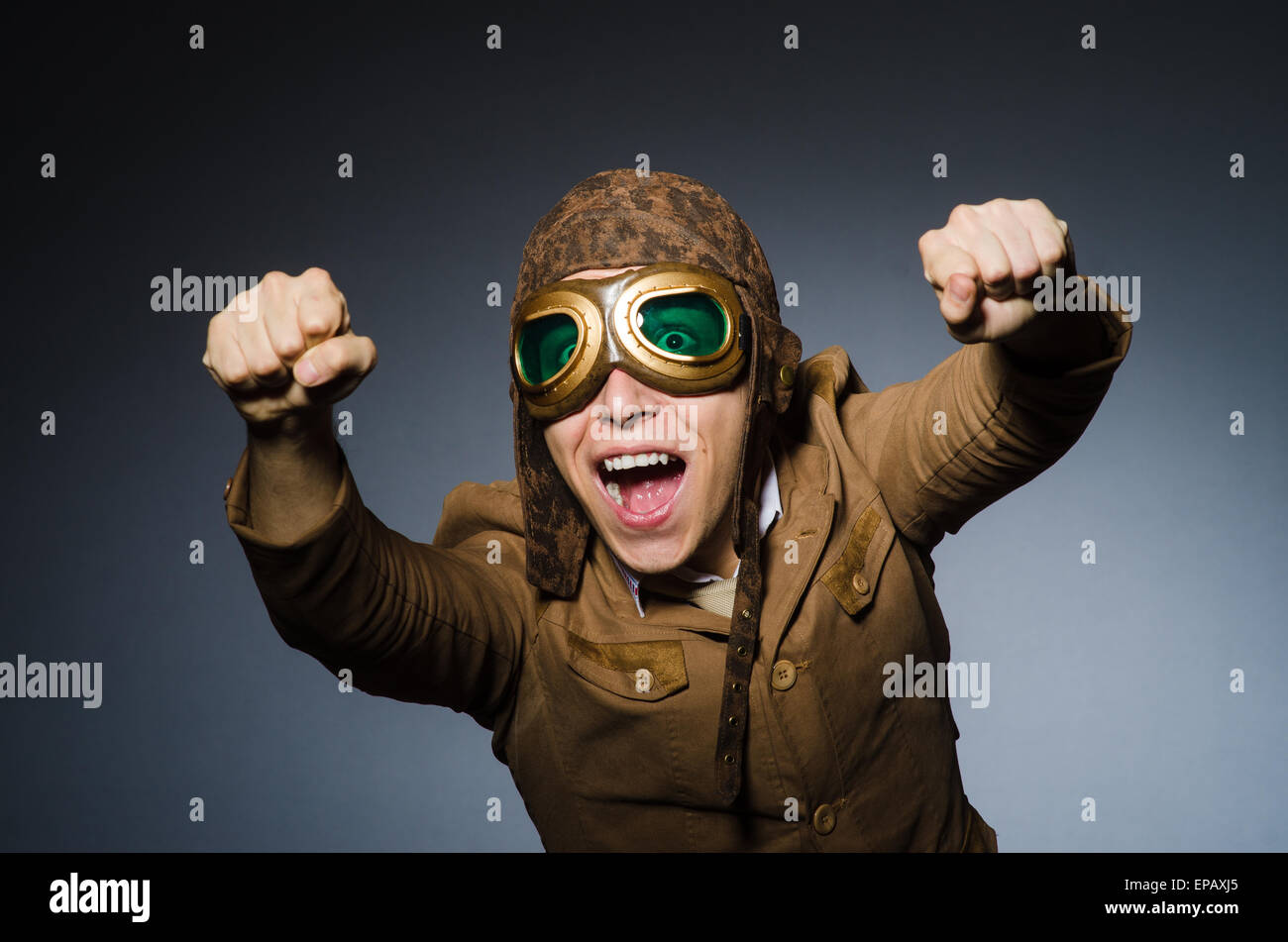 Funny pilot with goggles and helmet Stock Photo - Alamy