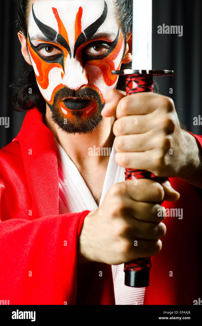 Man with sword and face mask Stock Photo - Alamy