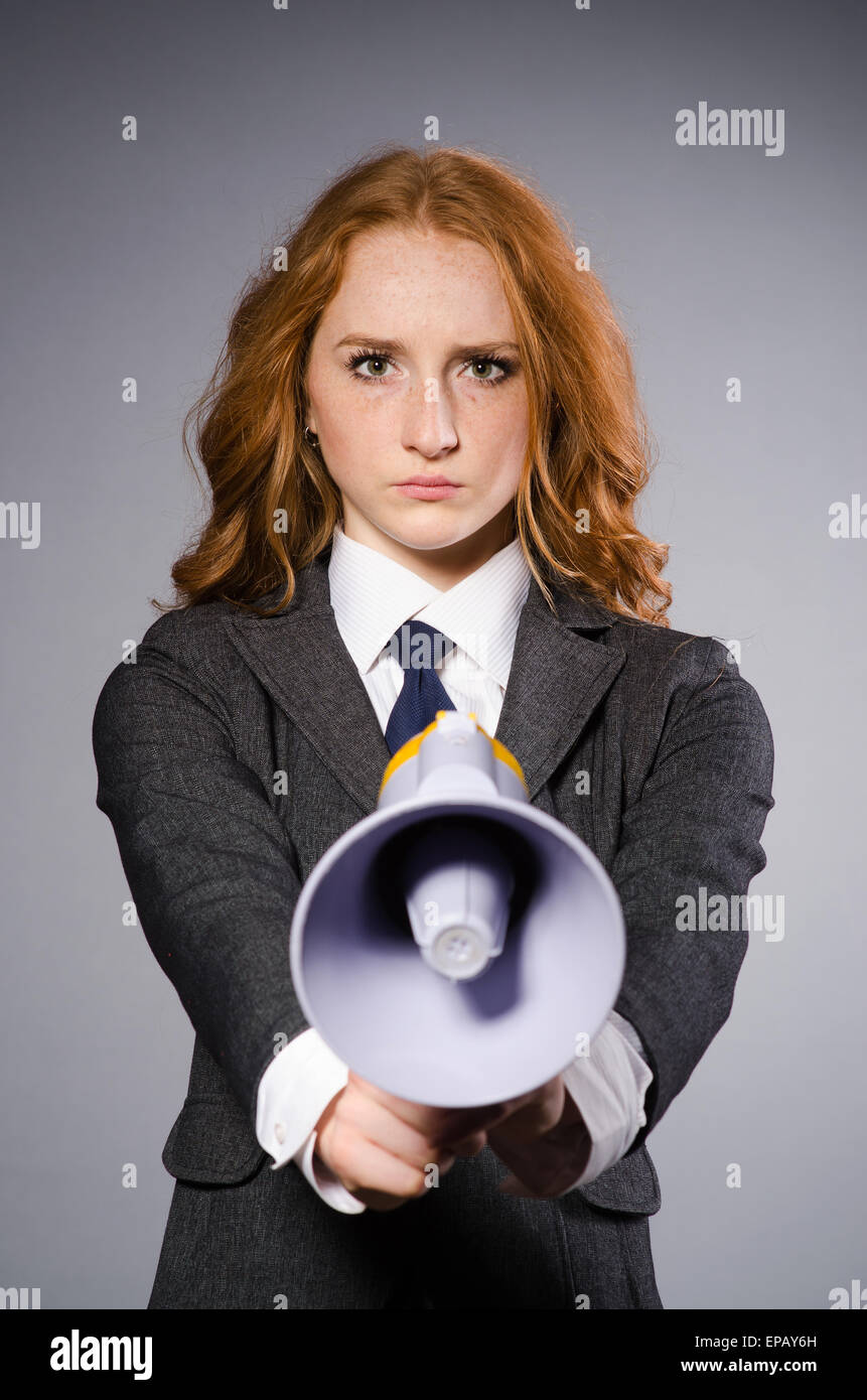 Woman with loudspeaker in studio Stock Photo - Alamy
