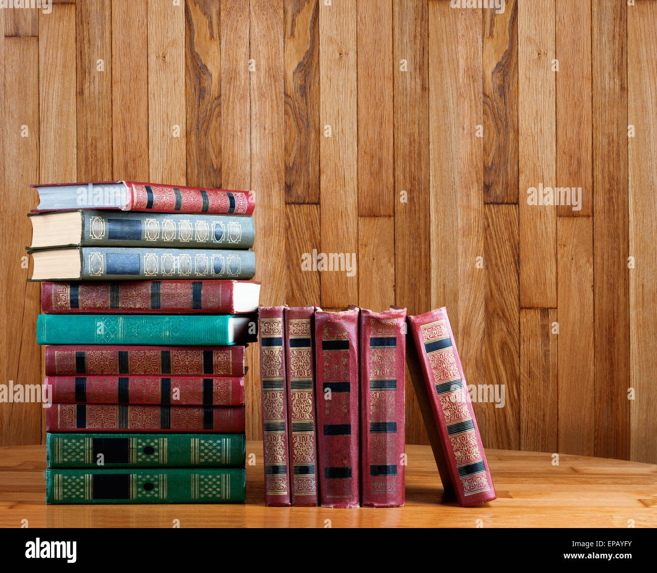 Richly decorated volumes of books with a gold lettering on the ...