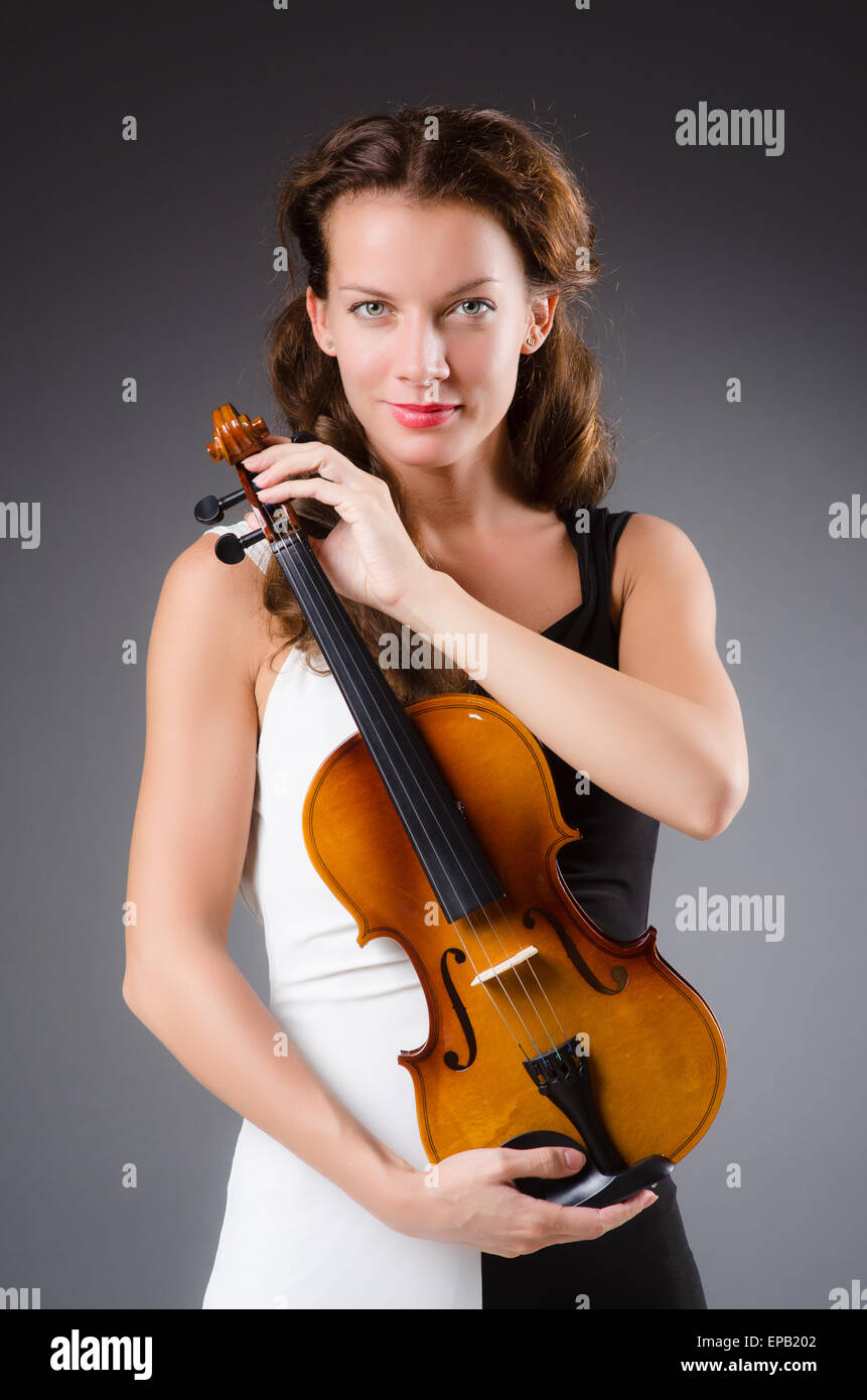 Woman artist with violin in music concept Stock Photo - Alamy