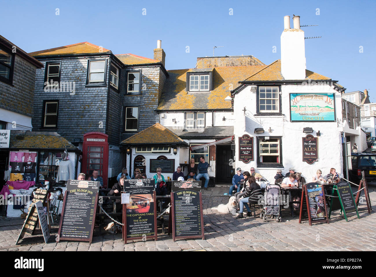 At Sloop Inn pub at St Ives harbour. Popular tourist destination ...
