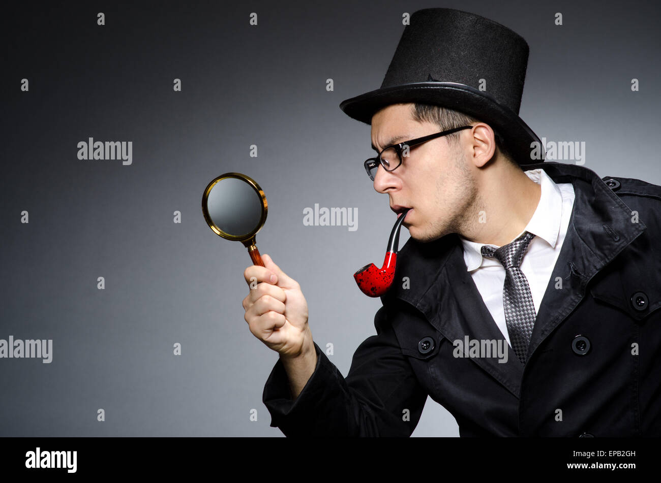 Funny detective with pipe and hat Stock Photo - Alamy