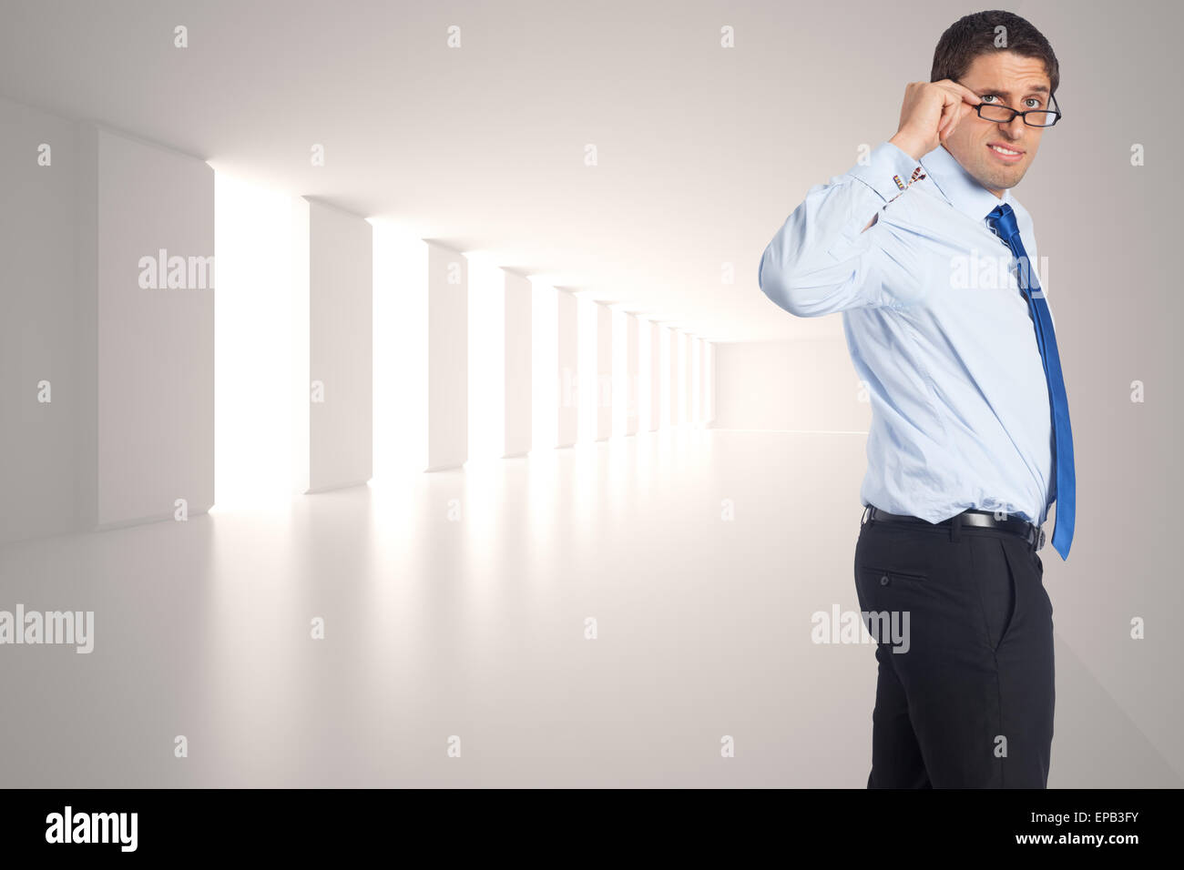 Composite image of thinking businessman tilting glasses Stock Photo - Alamy
