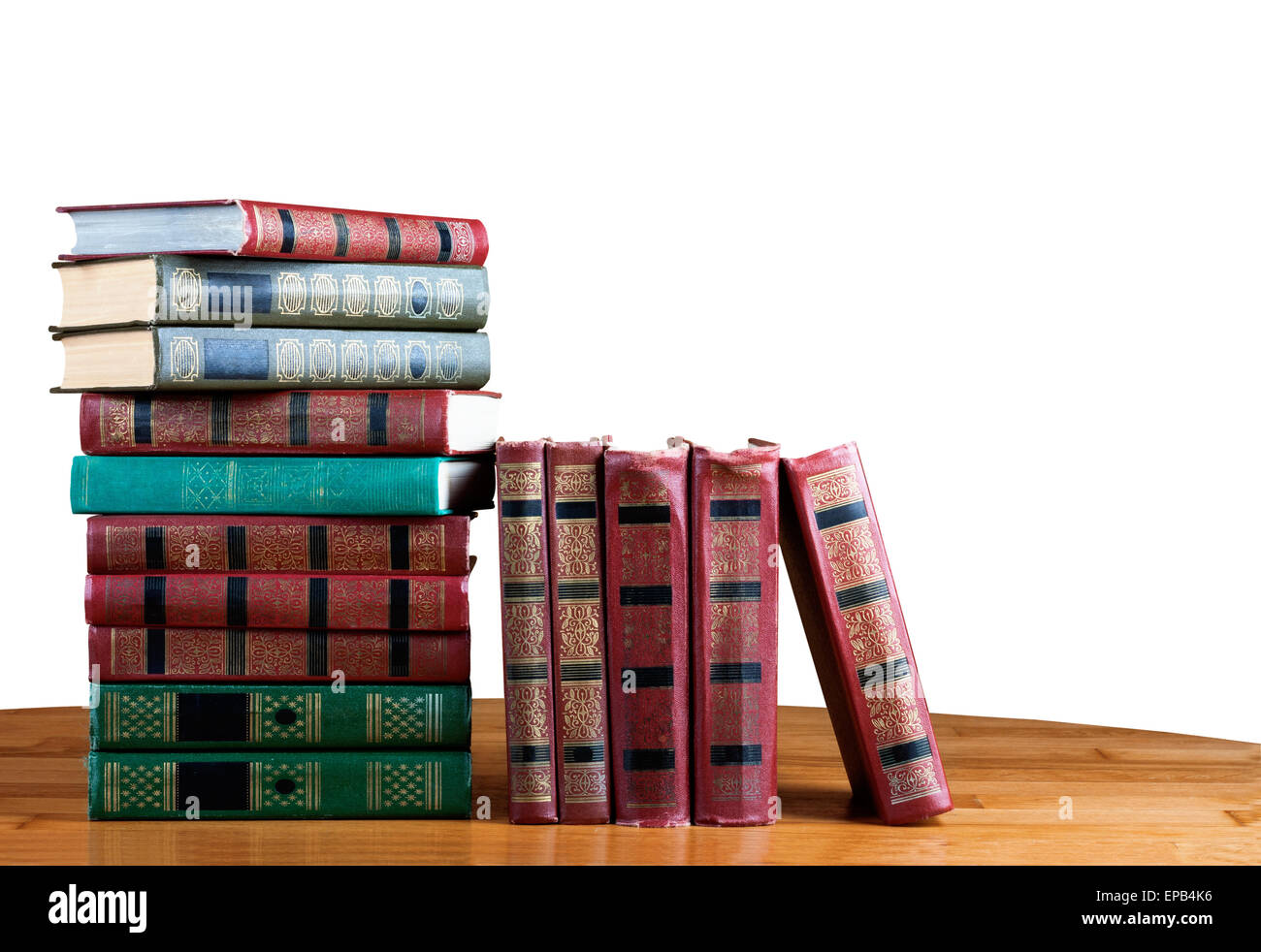 Richly decorated volumes of books with a gold lettering on the white ...