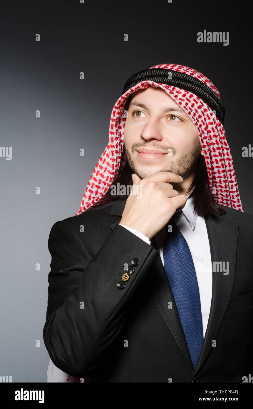 Arab businessman againt grey background Stock Photo - Alamy