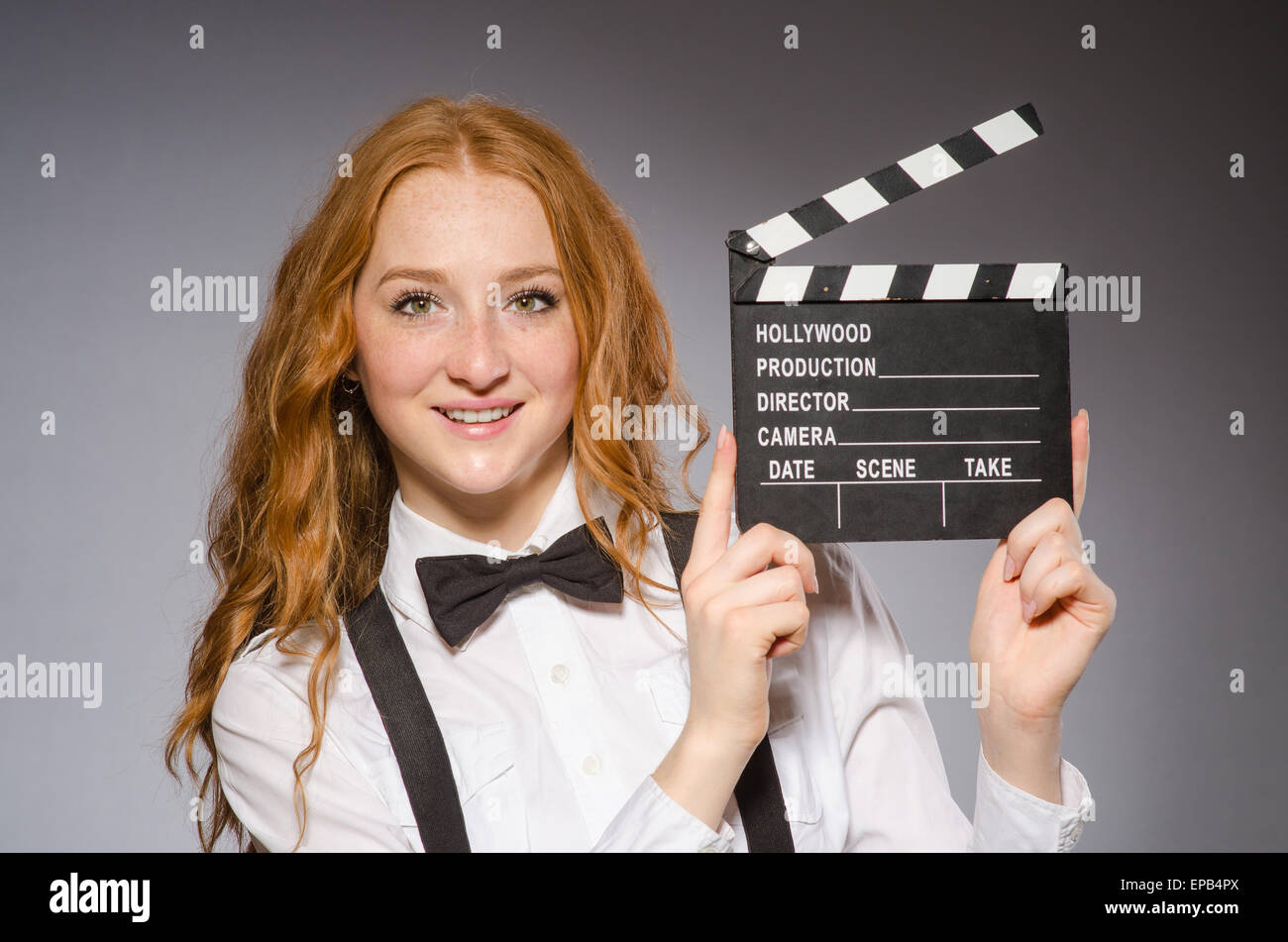 Young woman with movie board Stock Photo - Alamy