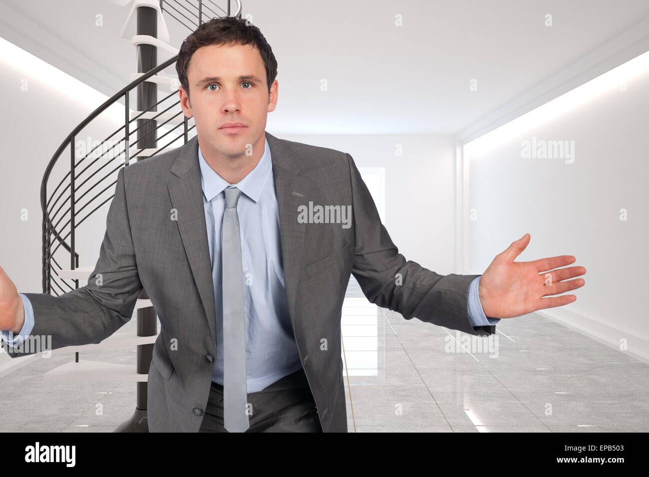 Composite image of businessman posing with hands out Stock Photo - Alamy