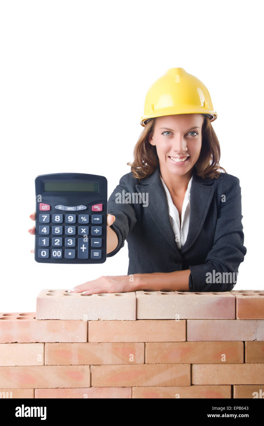 Woman construction worker with calculator on white Stock Photo - Alamy