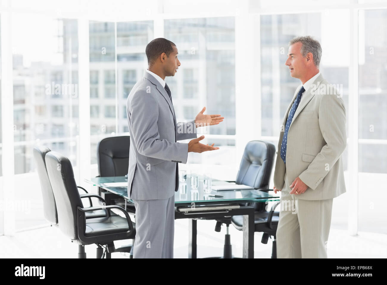 Businessmen speaking in the conference room Stock Photo - Alamy