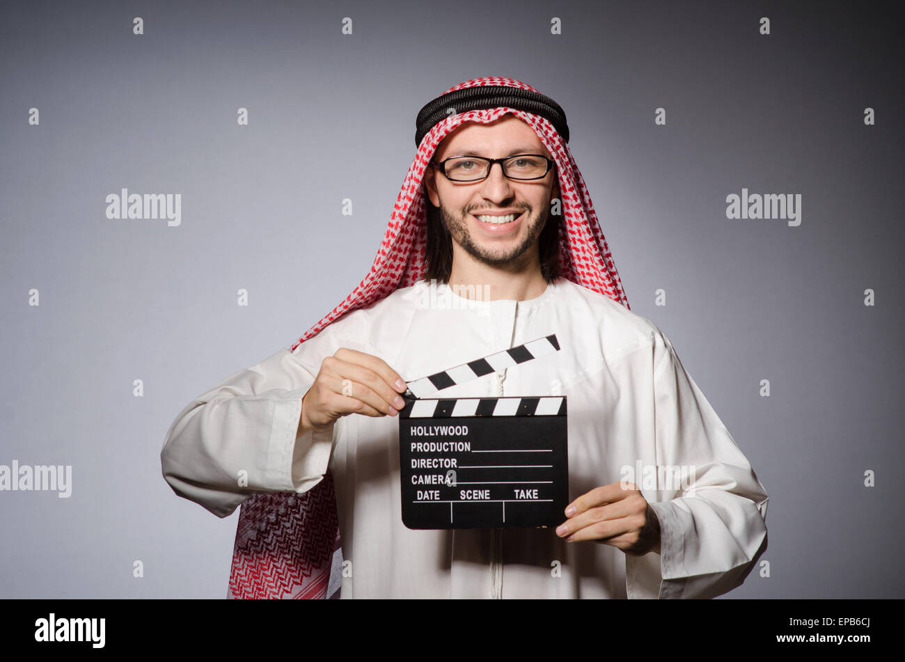 Arab with movie clapper board Stock Photo - Alamy