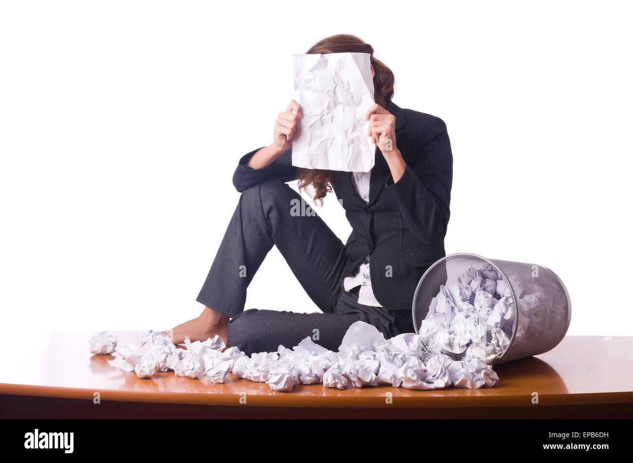 Woman with lots of discarded paper Stock Photo - Alamy