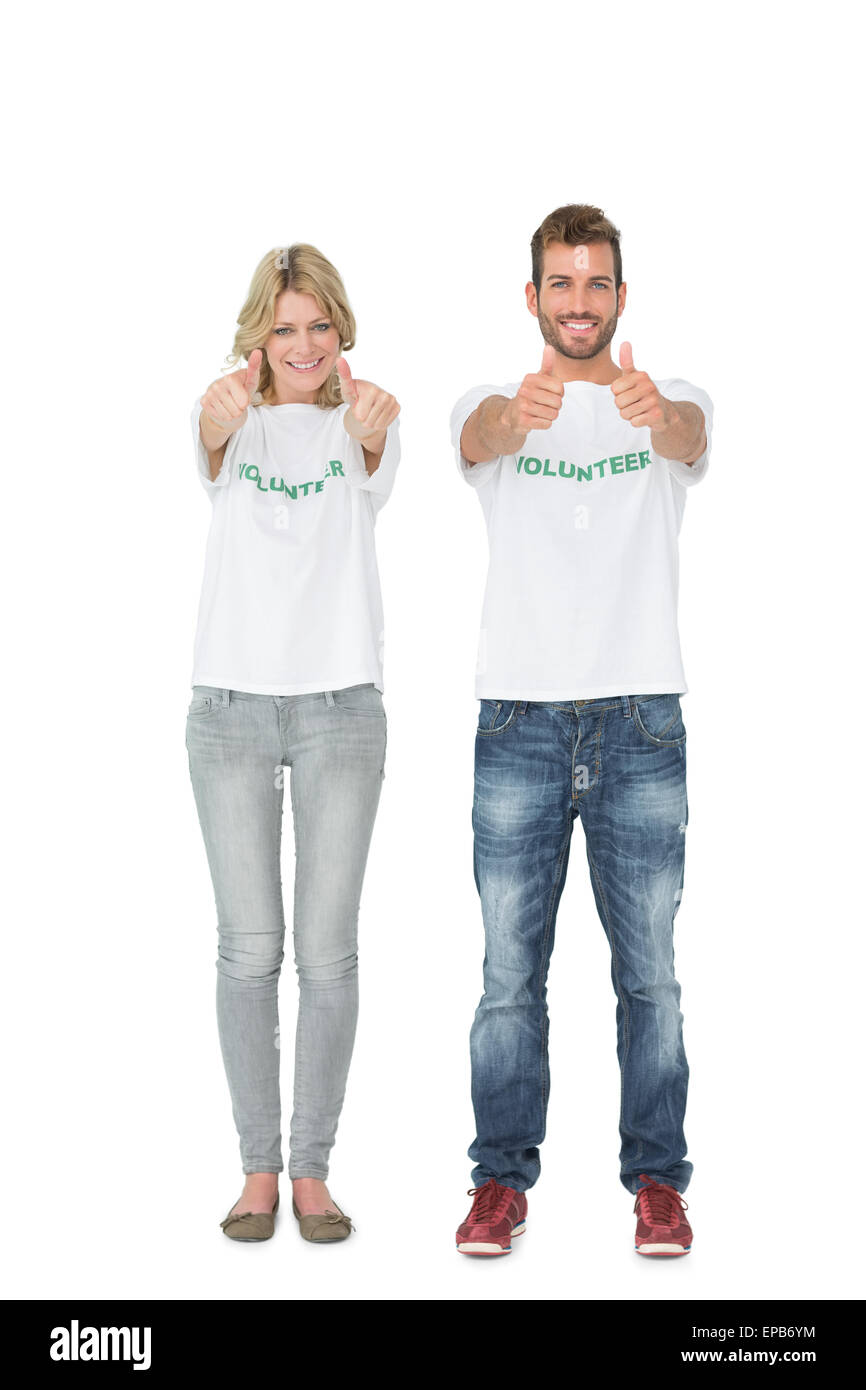 Portrait of two volunteers gesturing thumbs up Stock Photo - Alamy