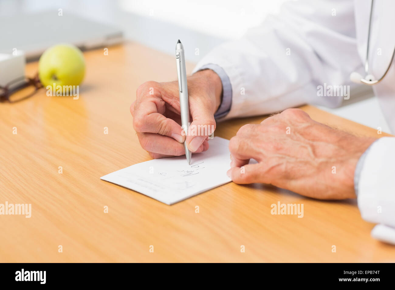 Doctor writing out a prescription hi-res stock photography and images ...