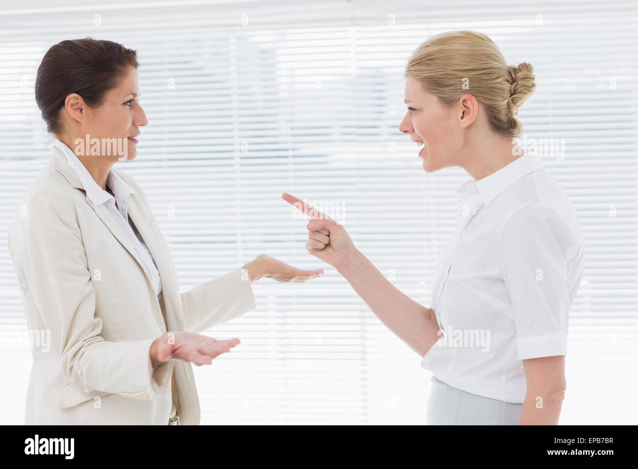 Businesswomen fighting in the office Stock Photo - Alamy