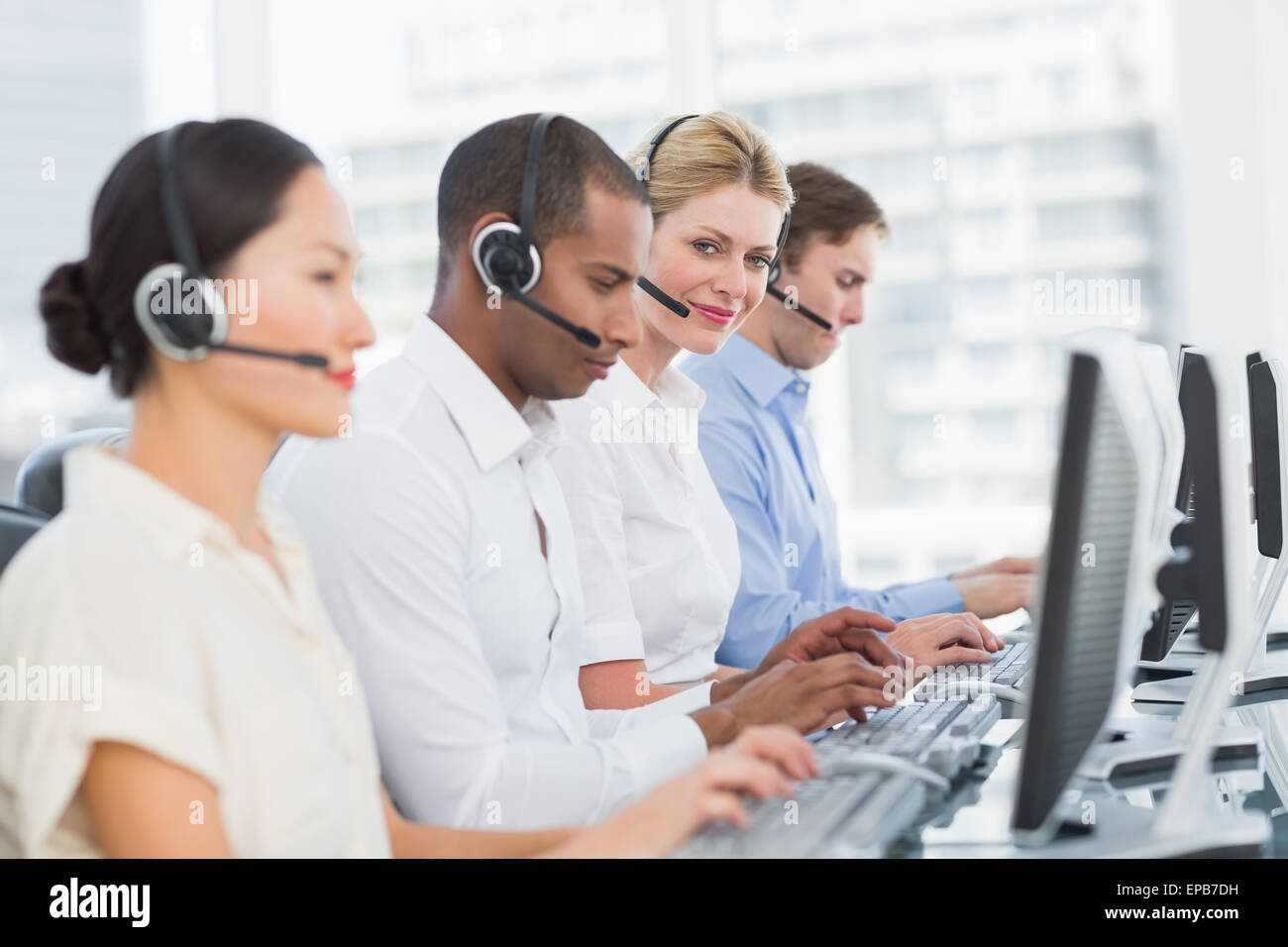 Operator using computers monitor hi-res stock photography and images ...